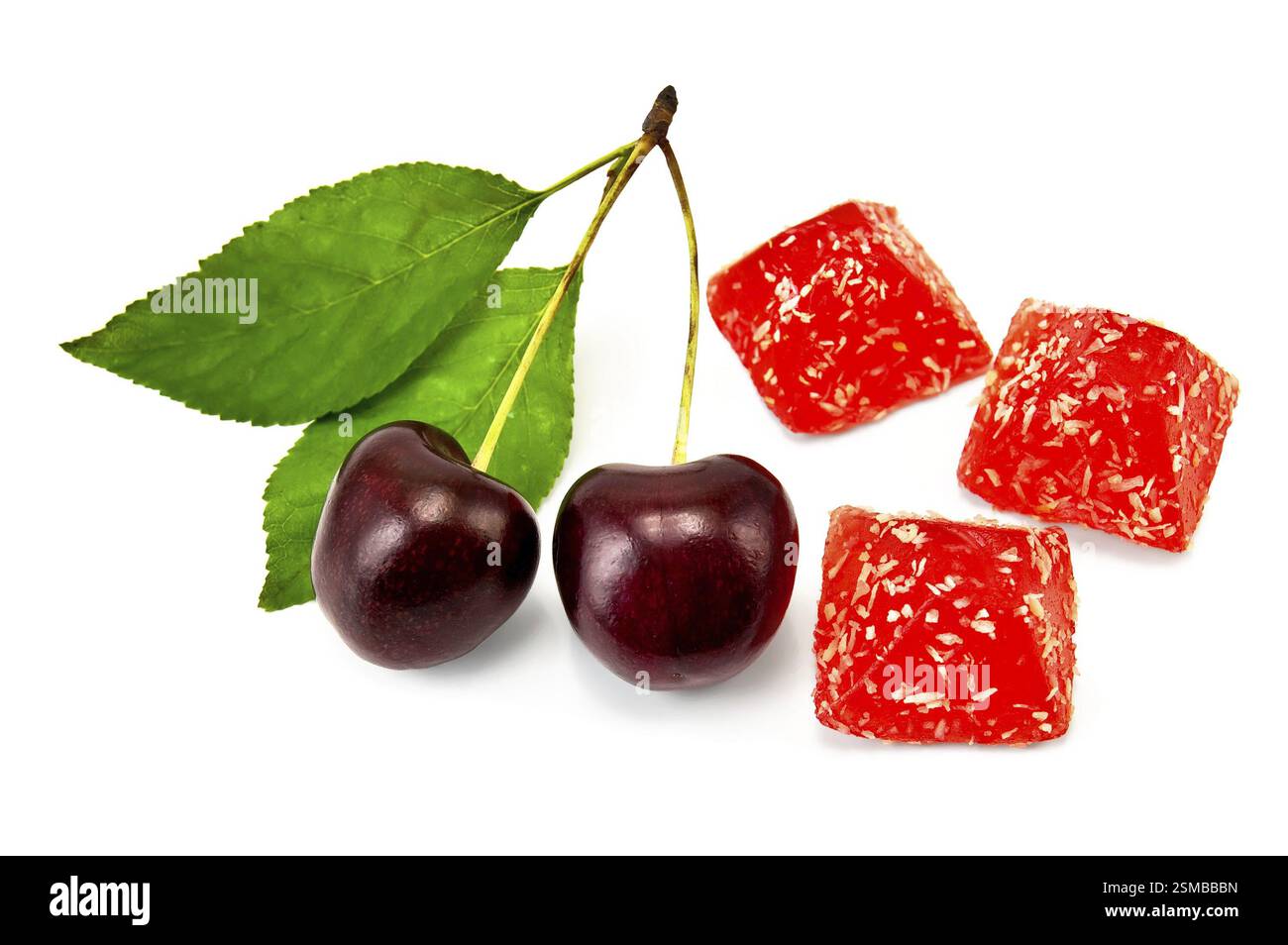 Three red jelly with two cherries and green leaves isolated on white ...