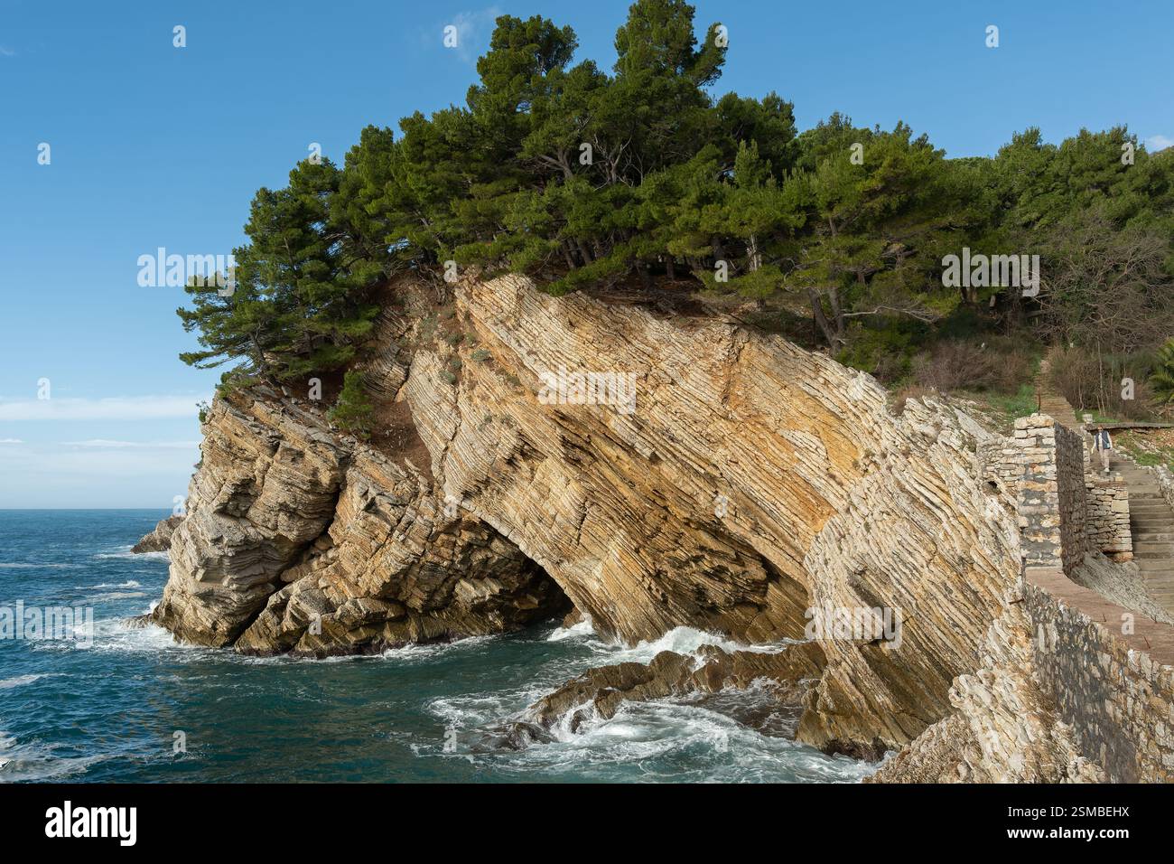 Mediterranean rocky cliff with pine trees overlooking the sea and a ...