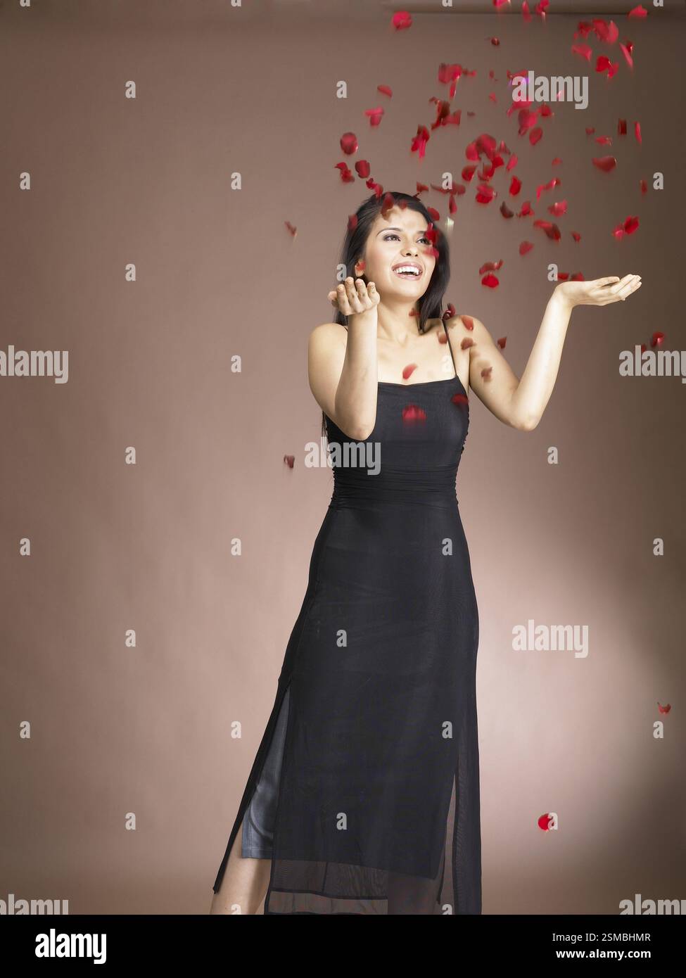 South Asian Indian woman throwing rose petals in air MR # 702 Stock ...