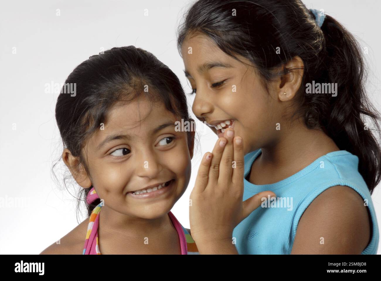 South Asian Indian two girls sharing secret in ear MR#364 Stock Photo ...
