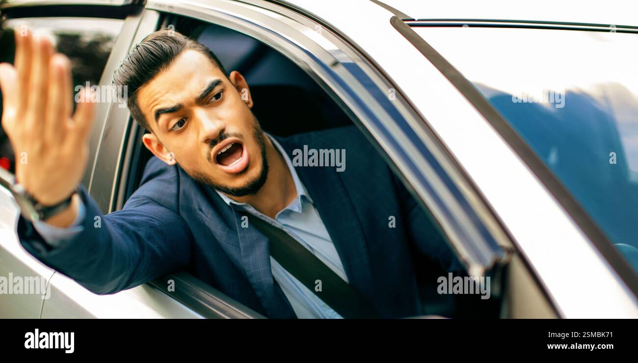 Furious middle-eastern businessman driving car, fighting on road Stock ...
