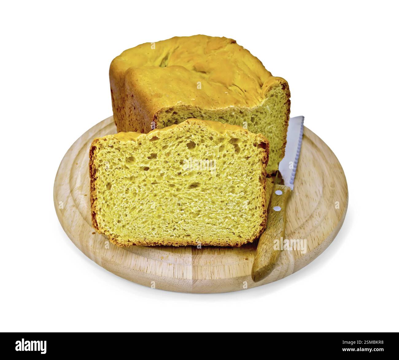 Homemade bread yellow on a round wooden board, knife isolated on white ...