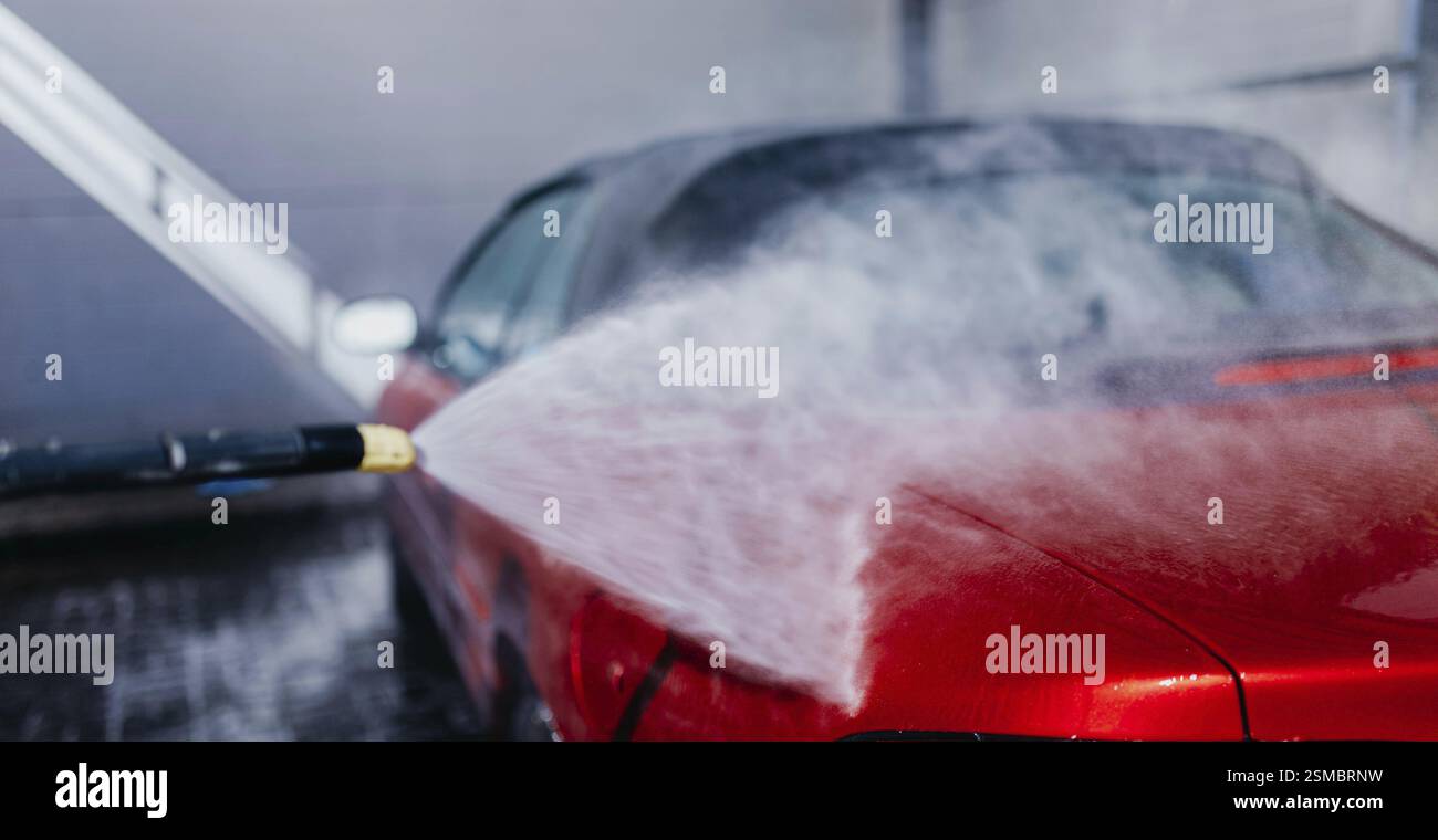 High-pressure water spray washing a red car Stock Photo - Alamy