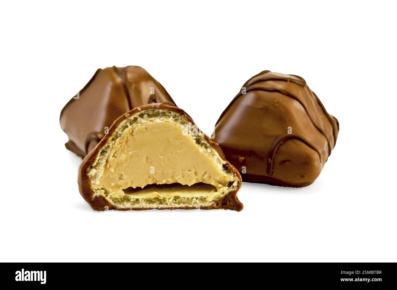 Two whole and one half of the chocolate candies with a pattern isolated ...