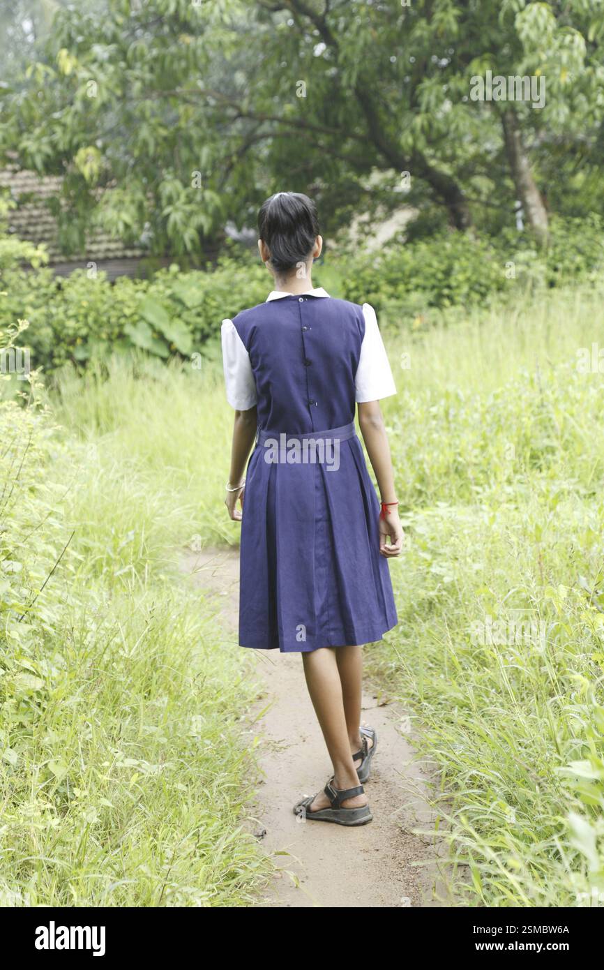 School going girl walking on pathway, Maharashtra, India MR#703Z Stock ...