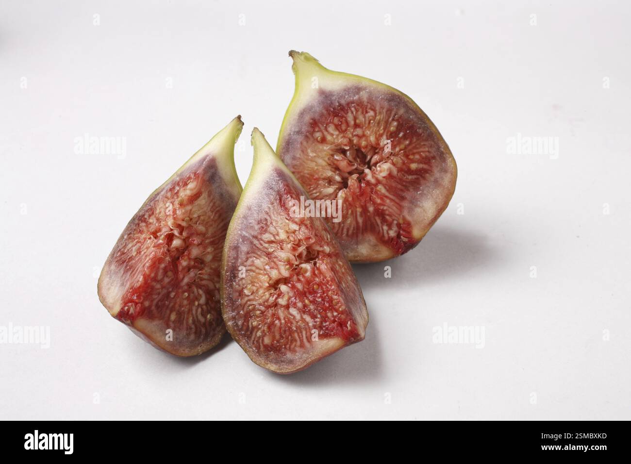 Fruit, Figs Ficus Carica Anjir cut in three pieces red juicy texture on ...