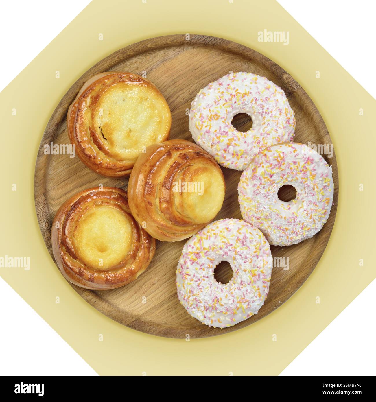 Wooden dish of cheese pies and donuts. Isolated image with white ...