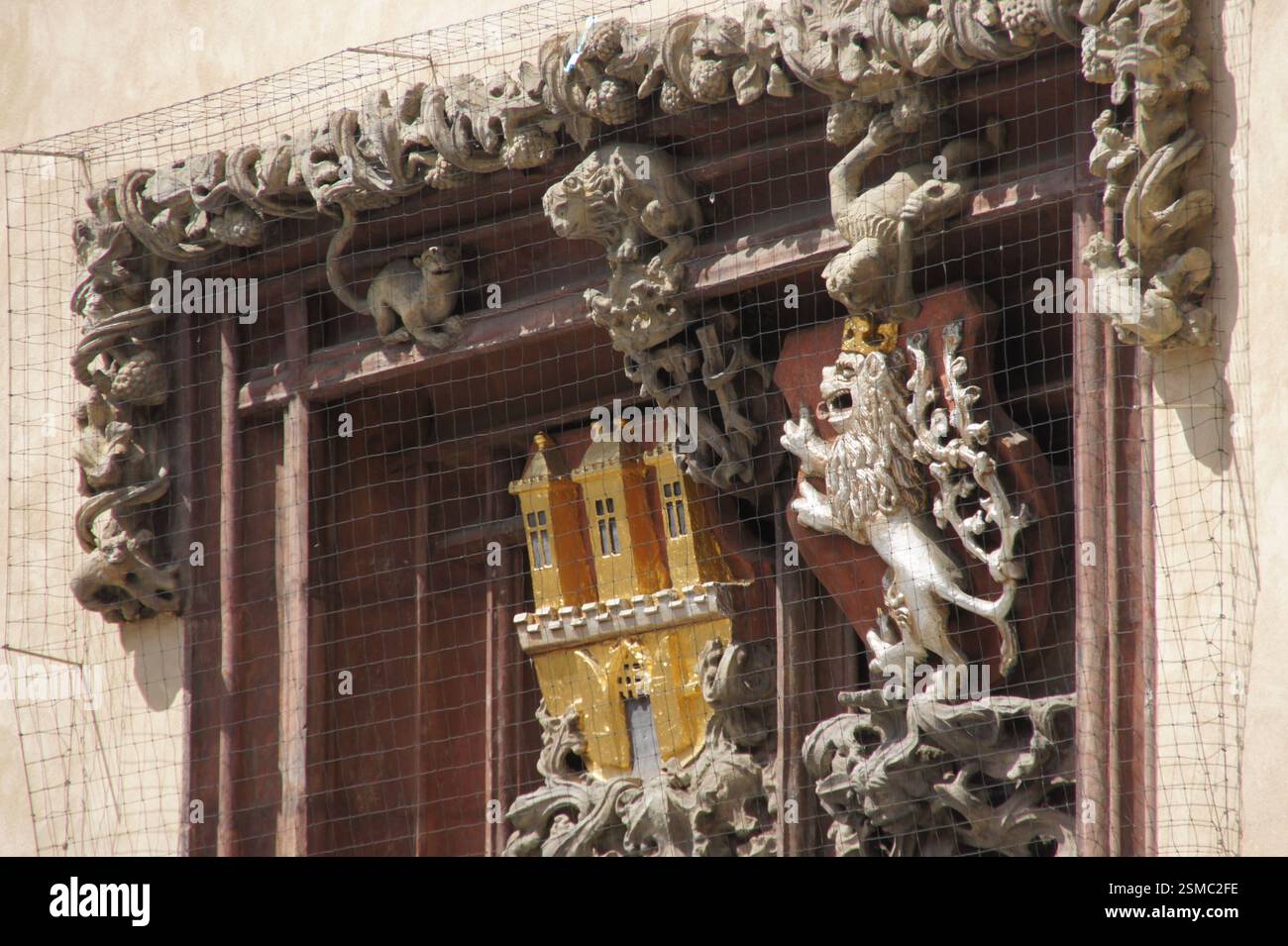Ornate stonework with a golden shield featuring a crowned lion. Symbol ...