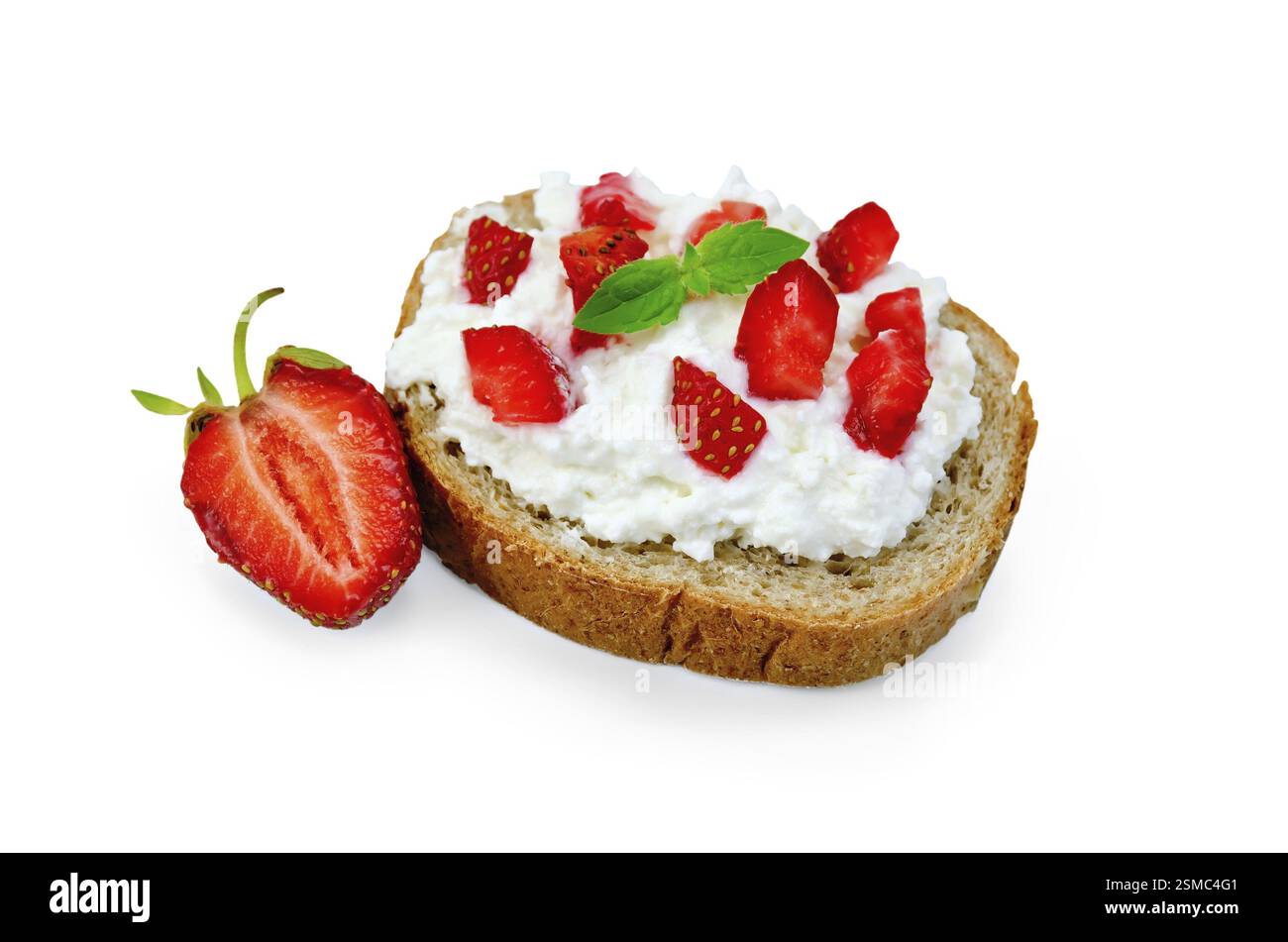 Loaf of French bread with curd cream and strawberries, mint and half ...