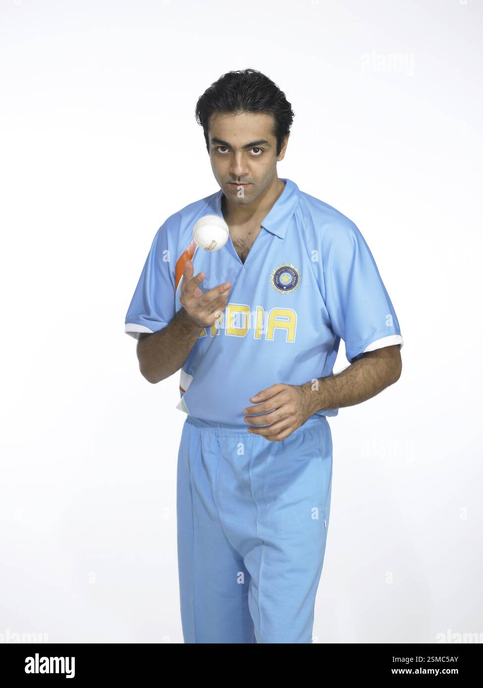 Indian bowler in action of bowling in cricket match MR#702A Stock Photo ...