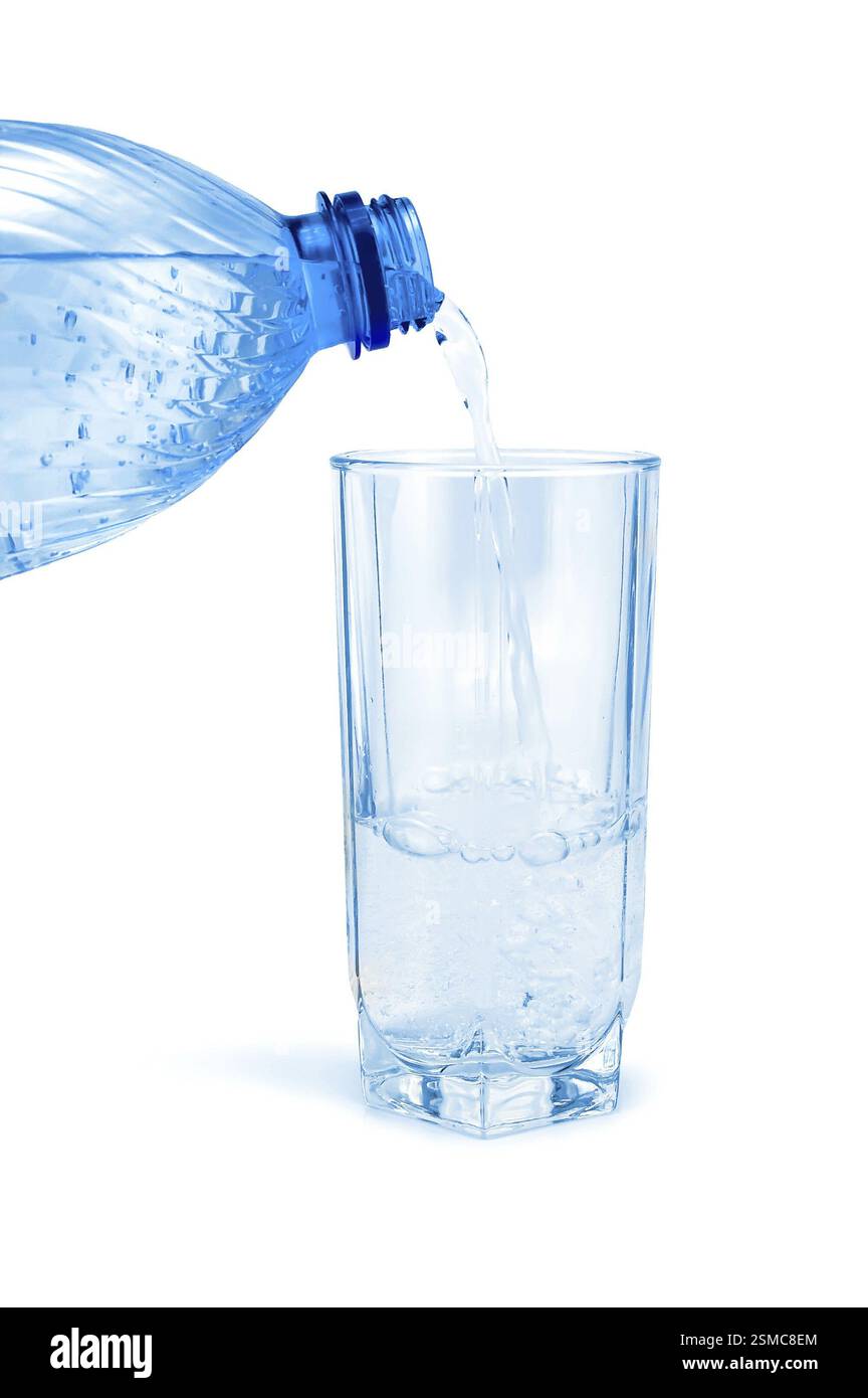 Mineral water in a glasses and bottle isolated on white background Stock Photo - Alamy