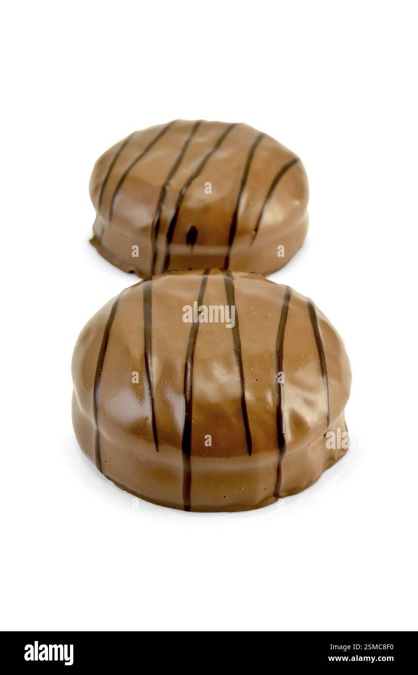 Two cakes with marshmallow, glazed of the chocolate isolated on white ...