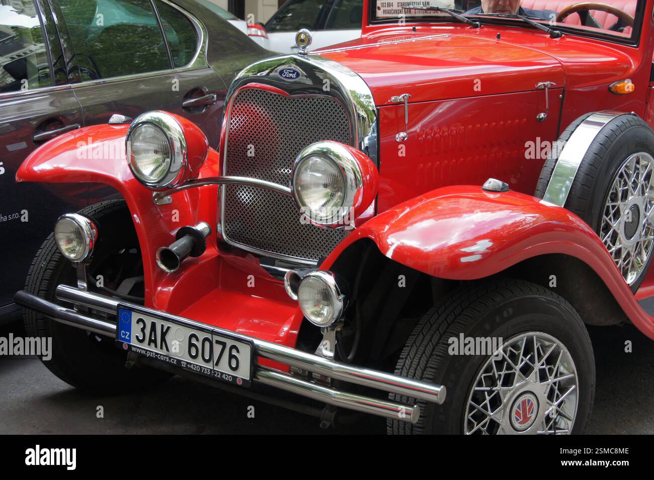 Vintage car, red Ford with chrome accents. Classic design, symbol of ...