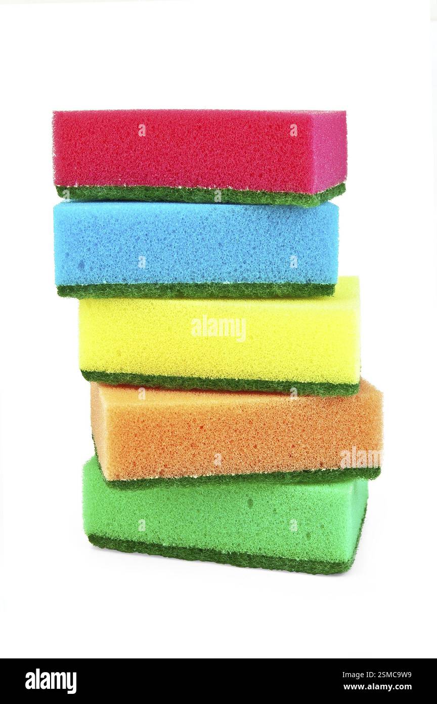 A stack of red, blue, yellow, orange and green sponges isolated on ...