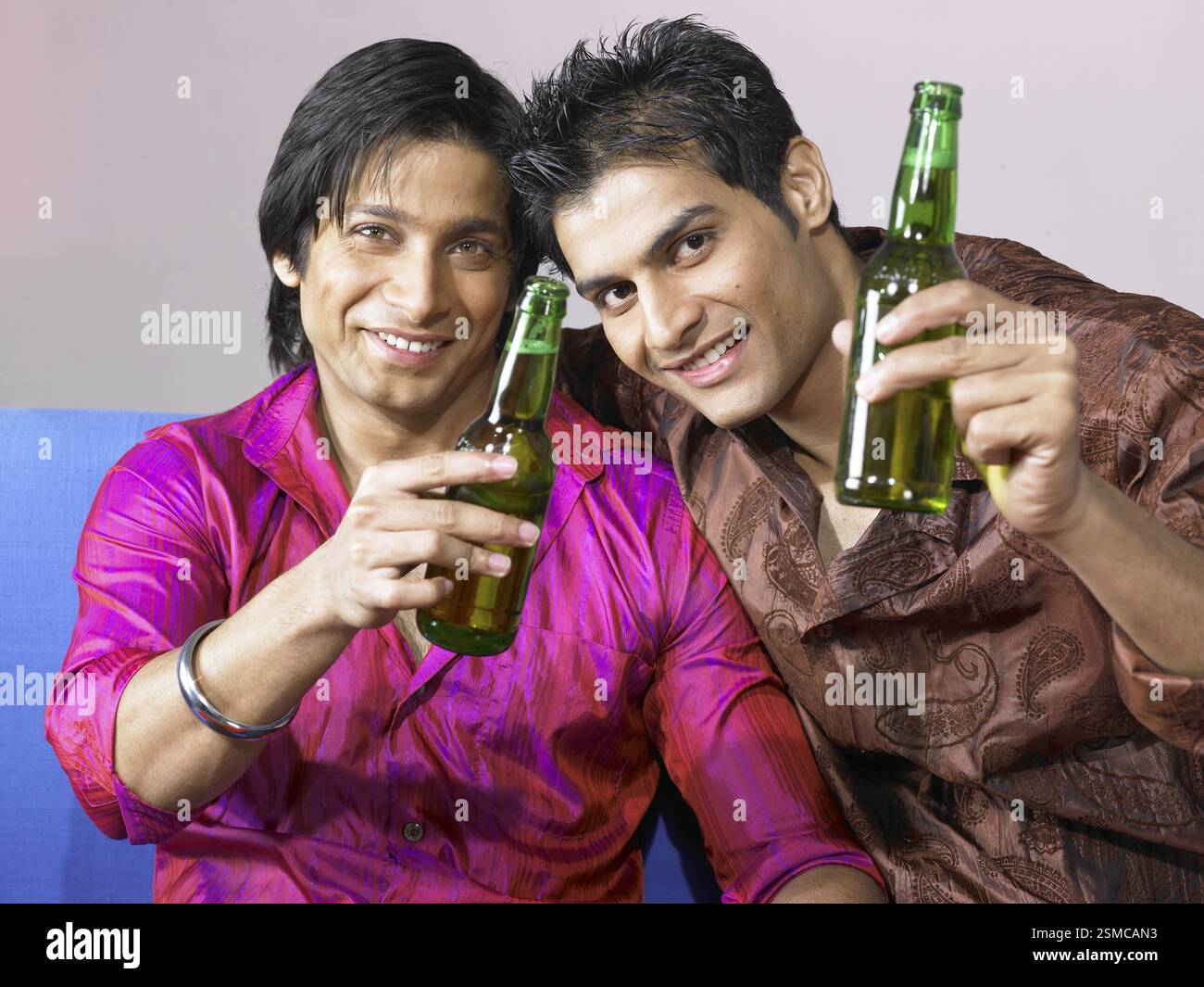 South Asian Indian men showing drink bottles celebrating party MR Stock ...