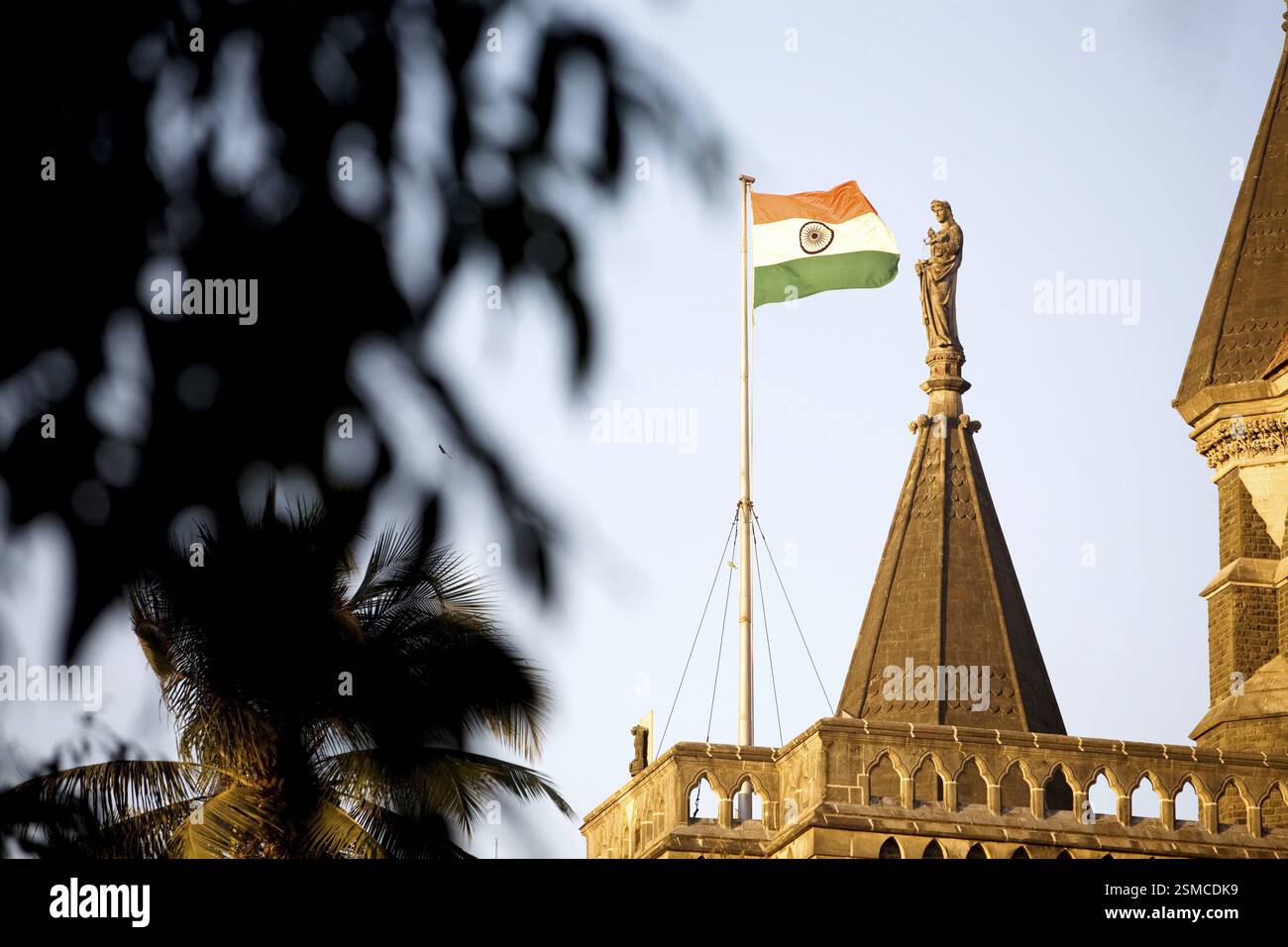 Indian flag on rooftop of high court building with statue of nyay ki ...
