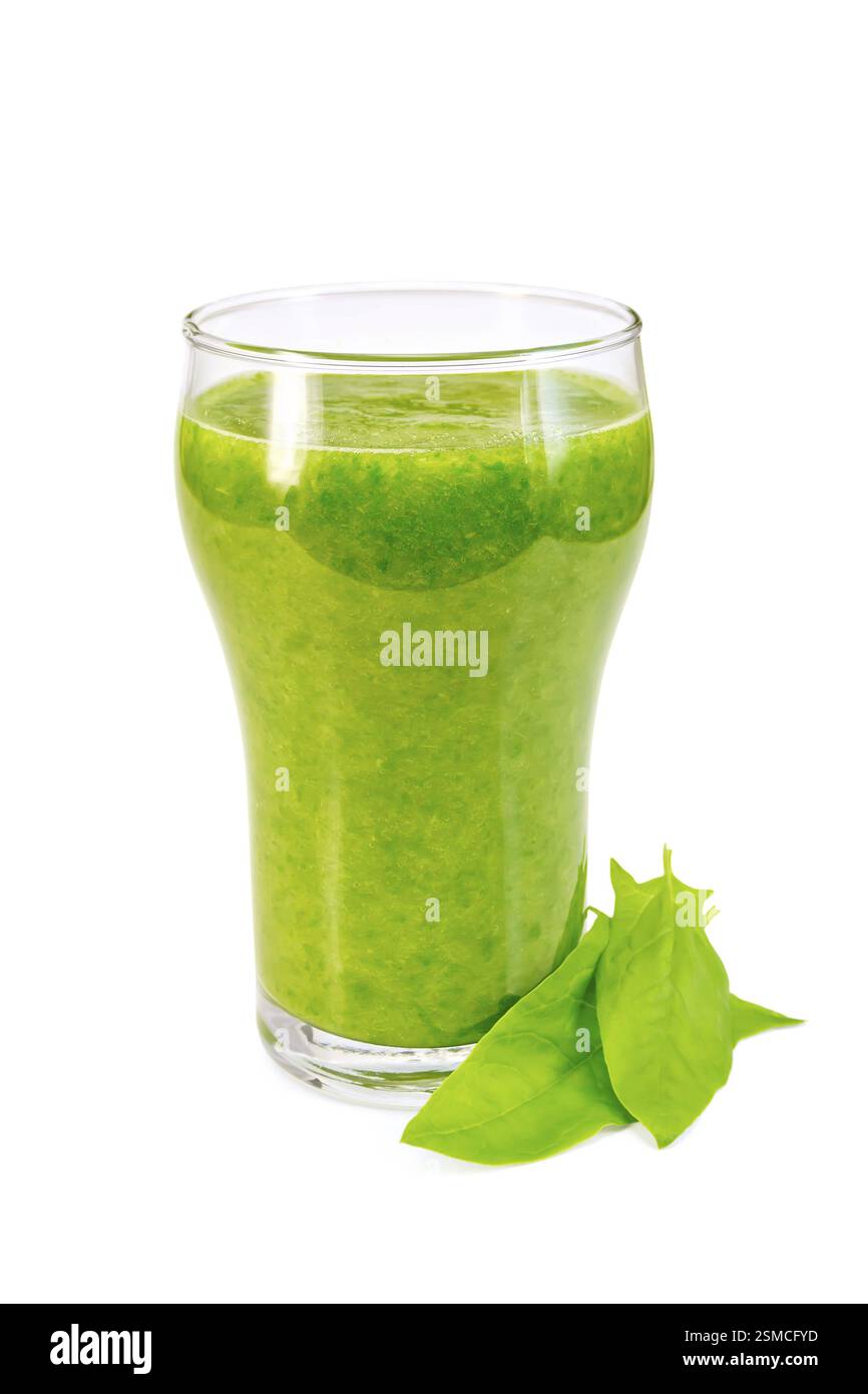 Glass cup with a cocktail of spinach, spinach leaves isolated on white ...