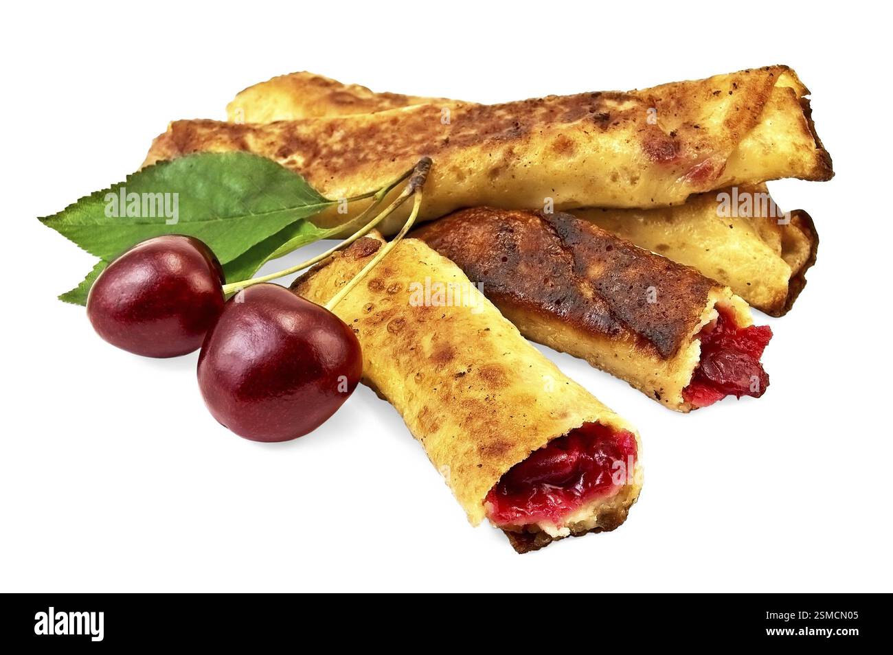 Pancakes with cherry filling, two cherries with green leaves isolated ...