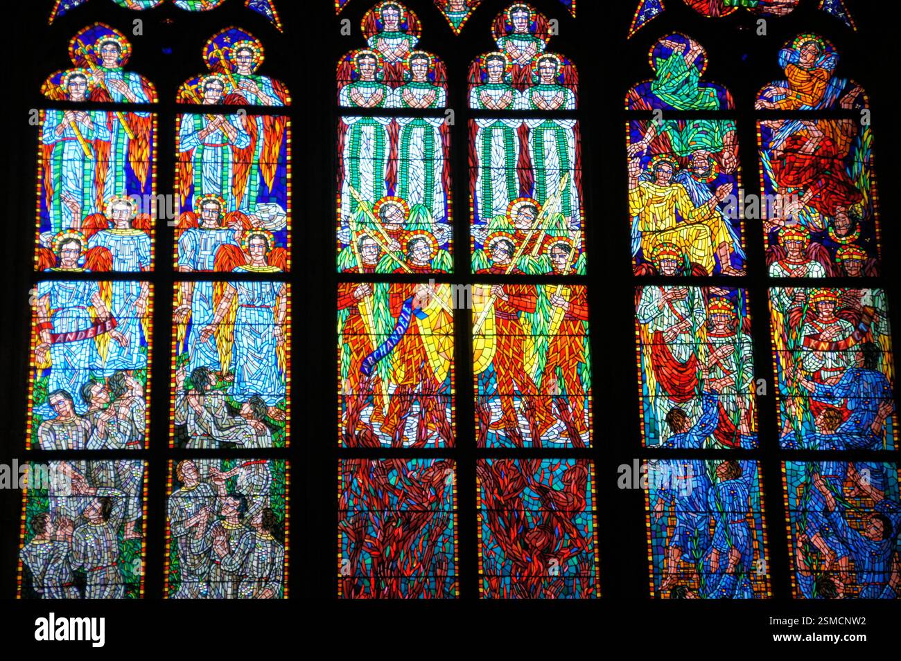 Stated glass window. Depicts religious figures and scenes. Vibrant ...