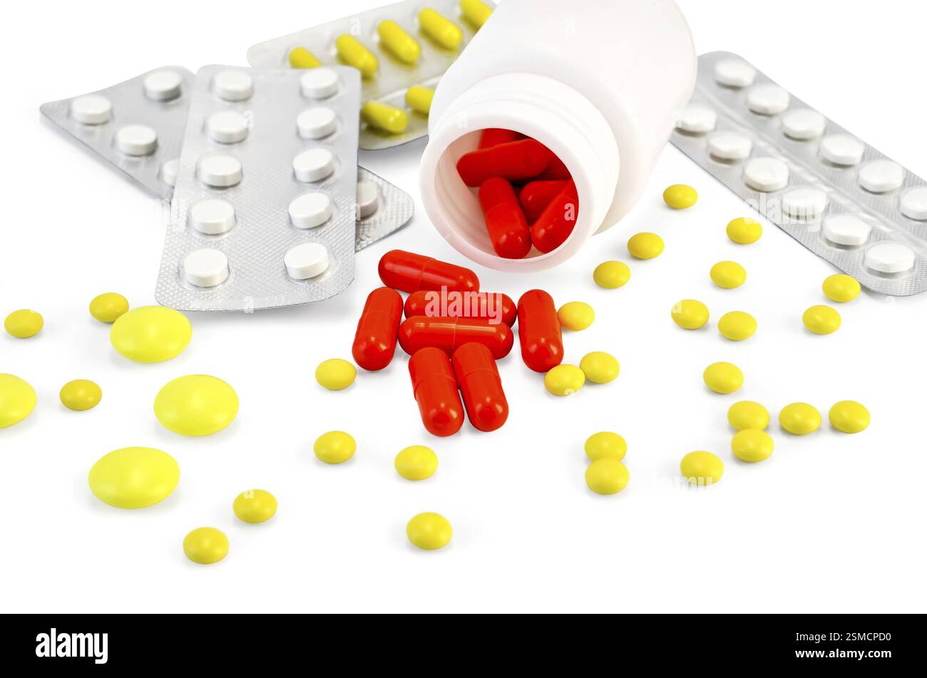 Red capsules in a jar, yellow capsules, tablets are white and yellow ...