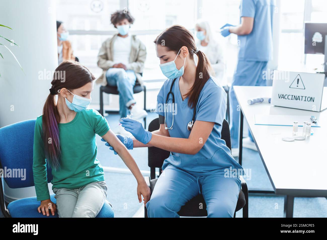 Teen Girl Receiving Vaccine Injection In Arm In Health Center Stock ...