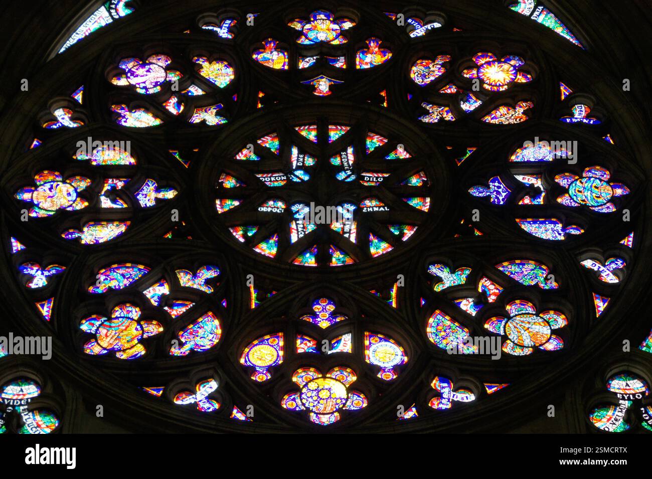 Stained glass rose window, geometric patterns and vibrant colors ...