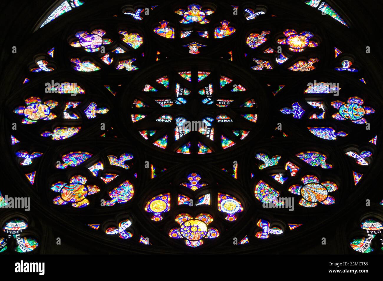 Stated glass rose window. Circular design with colorful glass panes ...