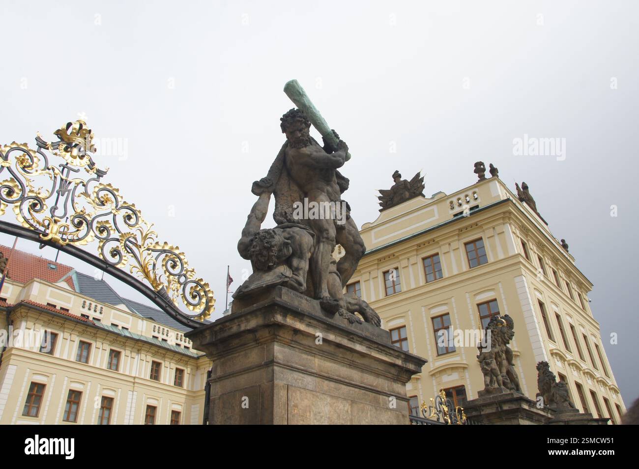 Prague Castle gate. Baroque sculpture of giant holding child ...