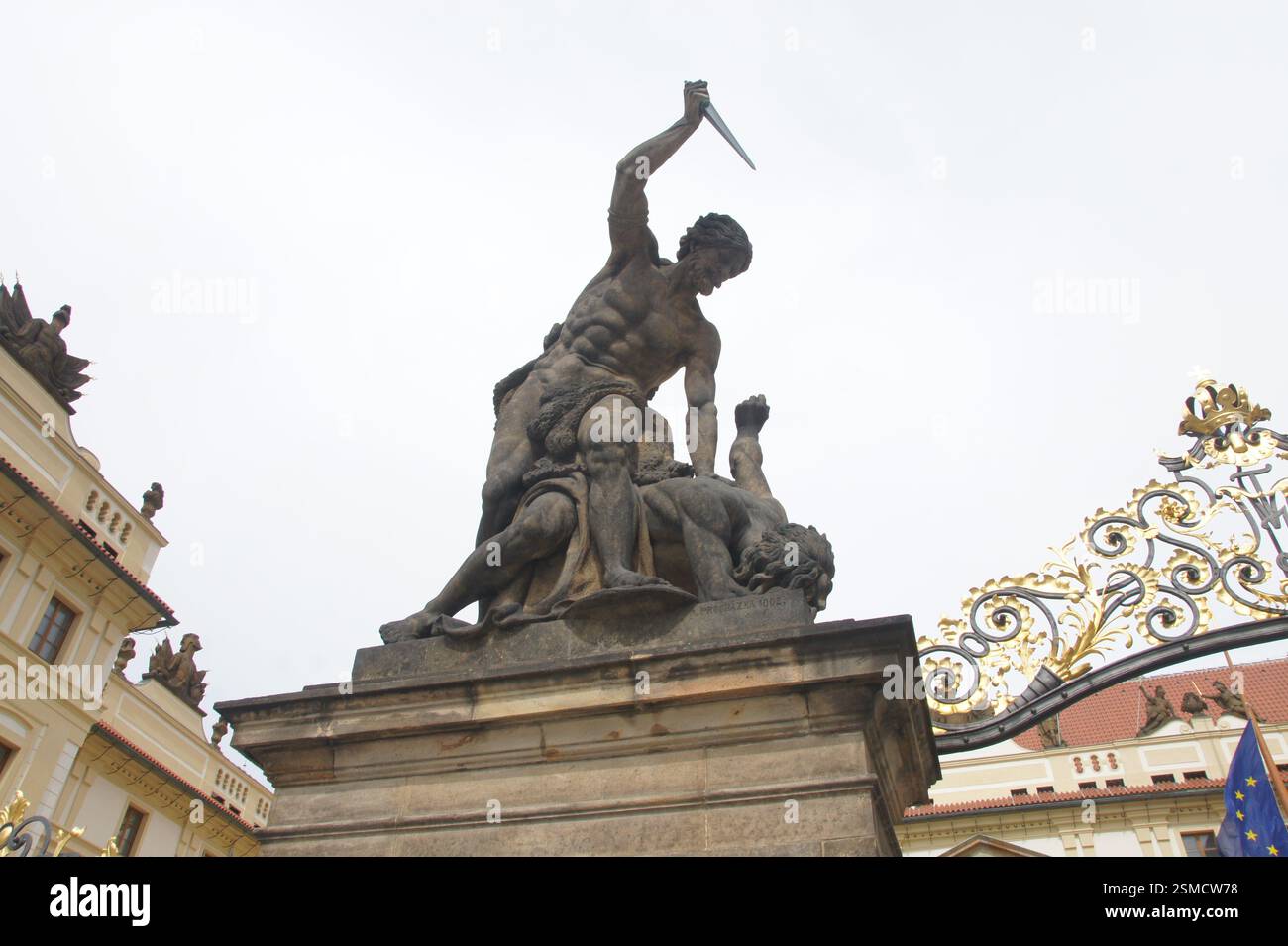 Statue. Man wielding a knife stands victorious over a fallen foe ...