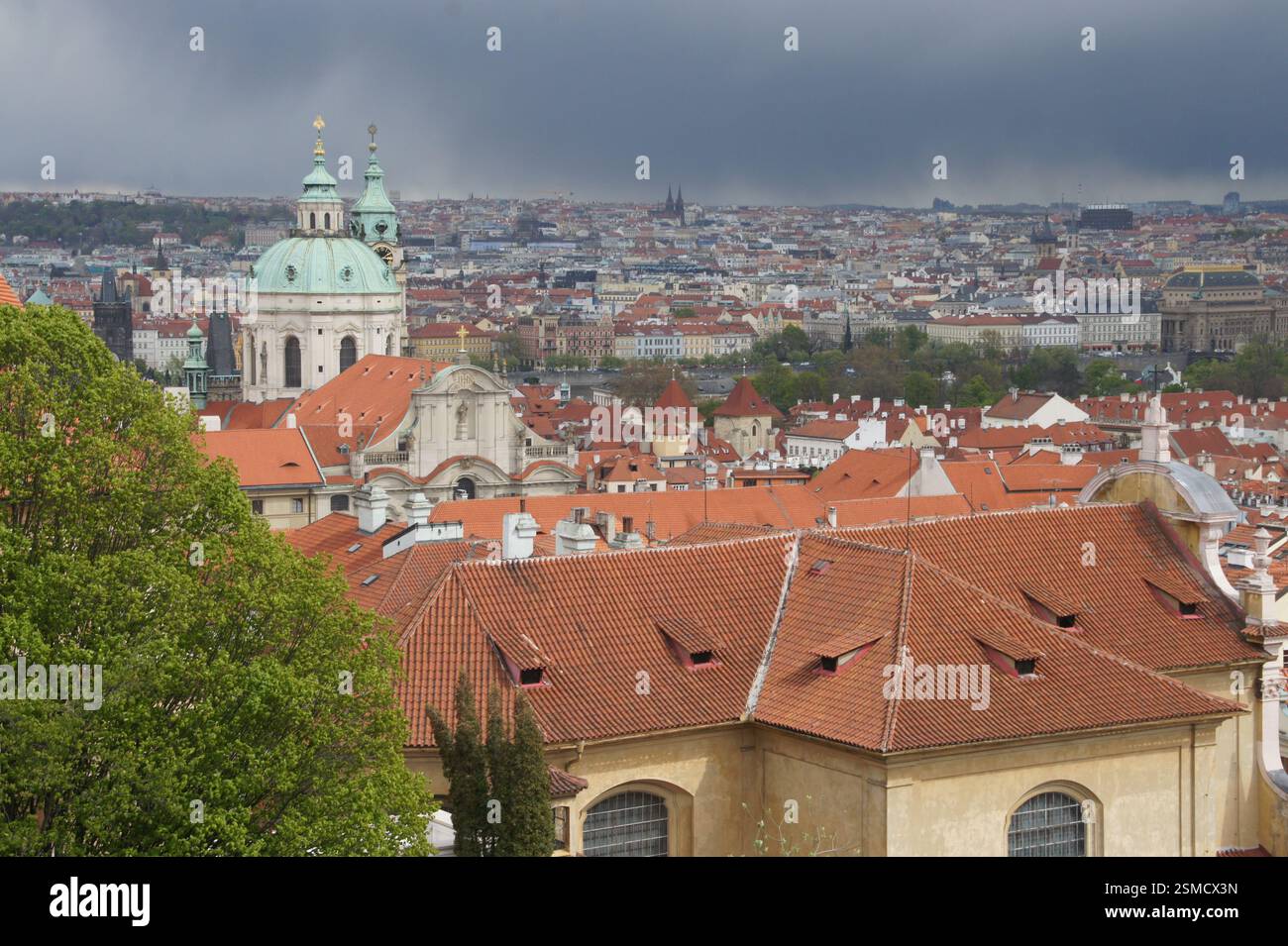 Prague Castle, a sprawling complex of buildings atop a hill overlooking ...