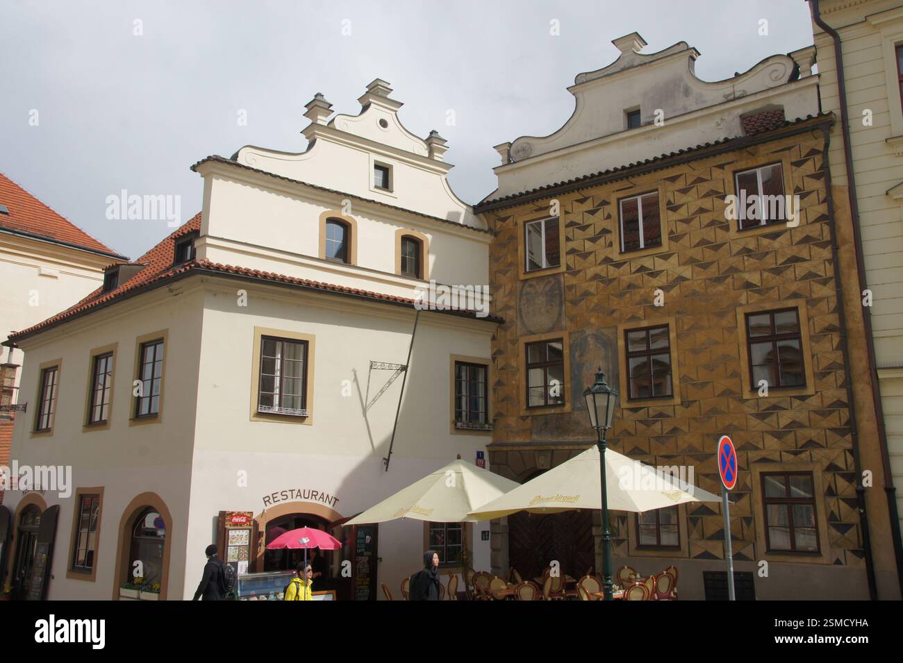 A charming restaurant building stands in the heart of Prague, inviting ...