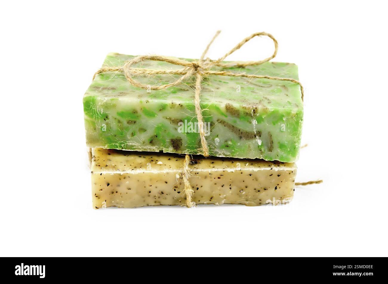 Yellow and green handmade soap, tied with string isolated on white ...