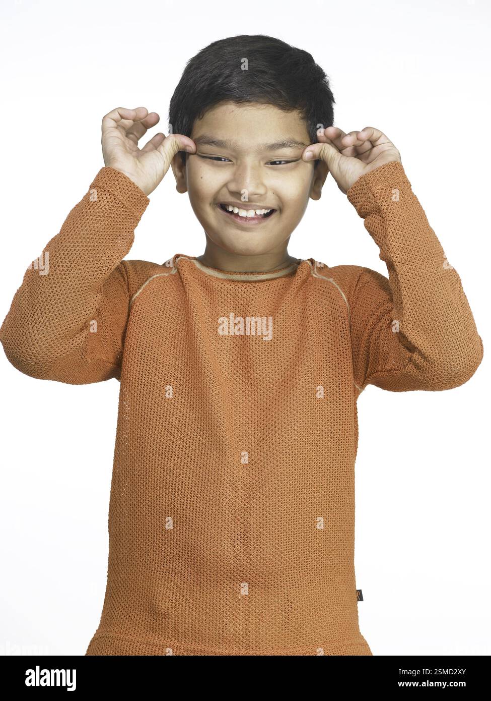 South Asian Indian boy making funny face in nursery school MR Stock ...