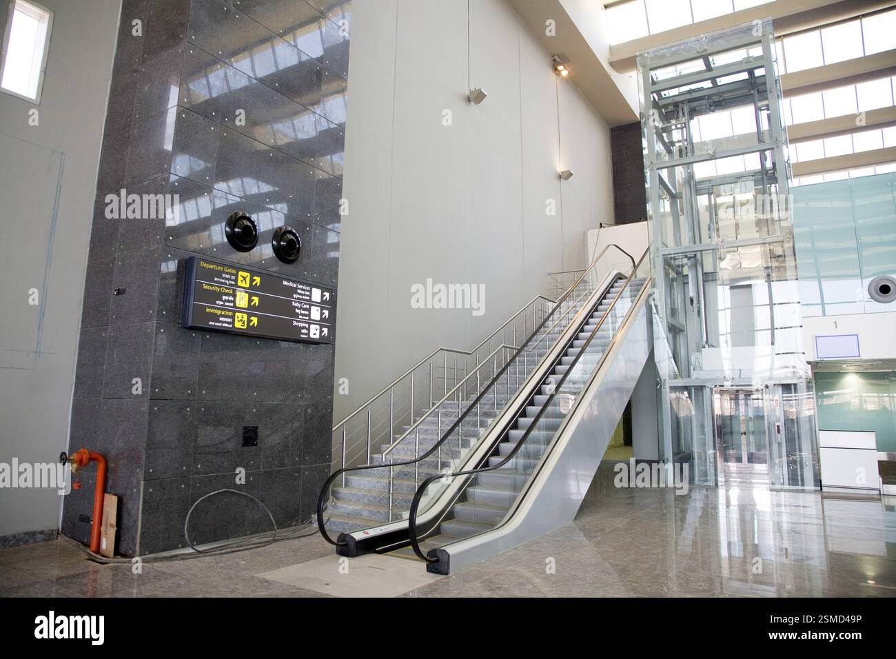 Elevator and step after check-in counters going towards final security ...