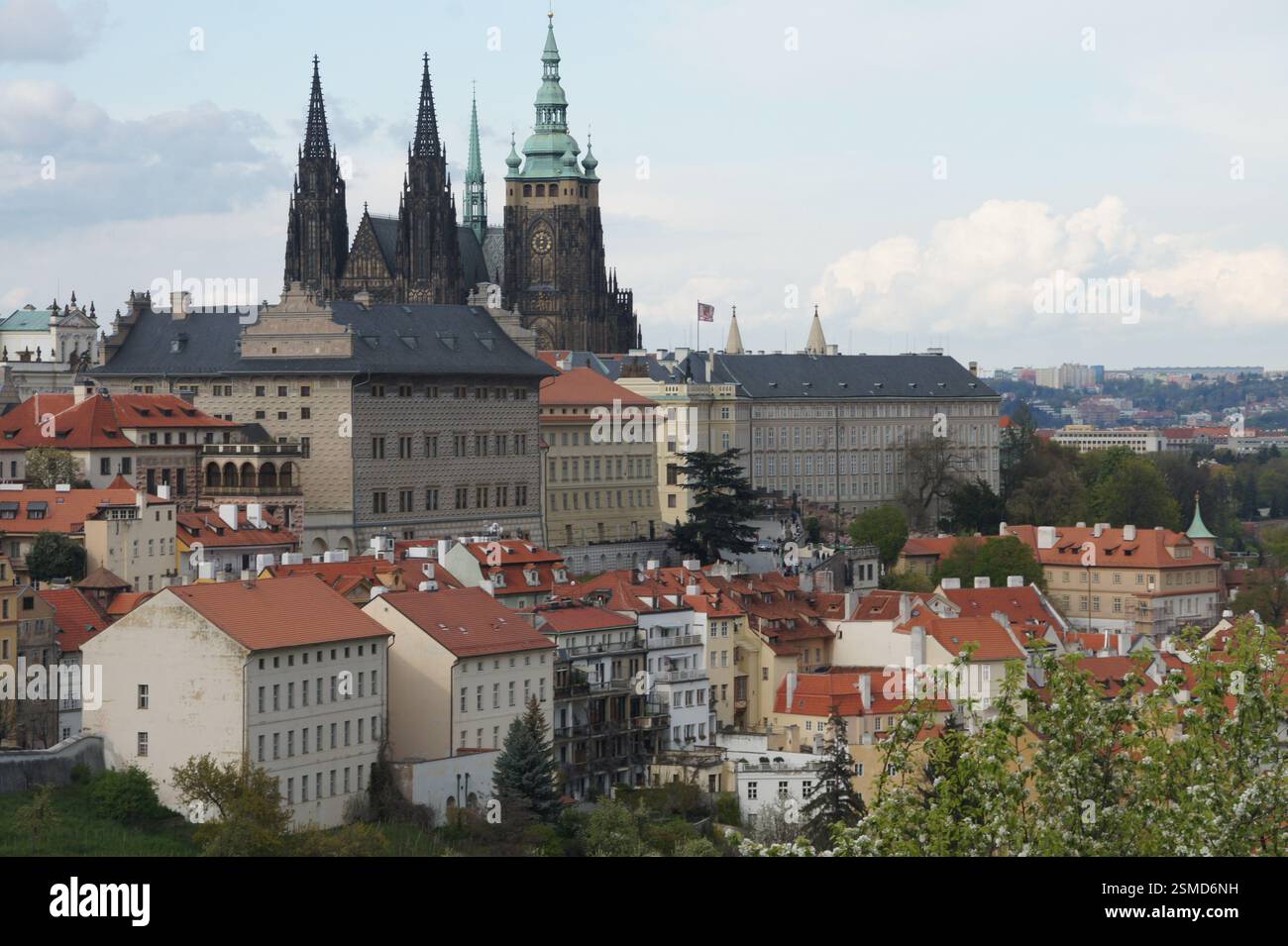 Prague Castle, a sprawling complex of buildings atop a hill overlooking ...