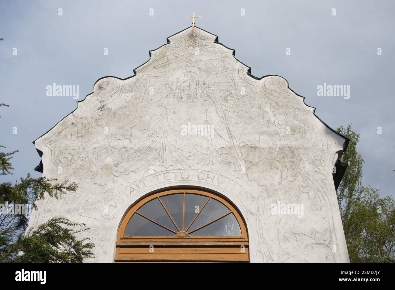 Church facade, detailed fresco depicting a religious scene, cross atop ...