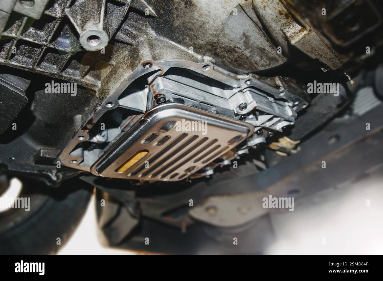 Mechanic's view of a car's underbody with metallic parts Stock Photo ...