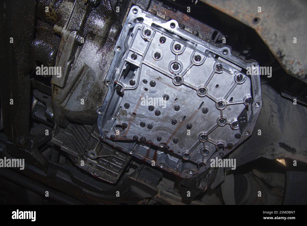 The underside of a car showing a complex arrangement of parts Stock ...