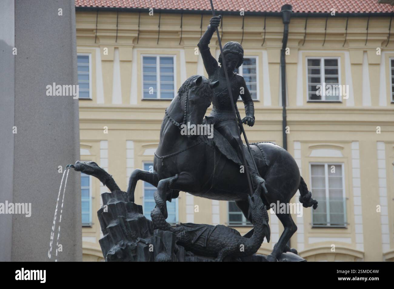 Statue of Saint George slaying the dragon in Czech Republic. Bronze ...