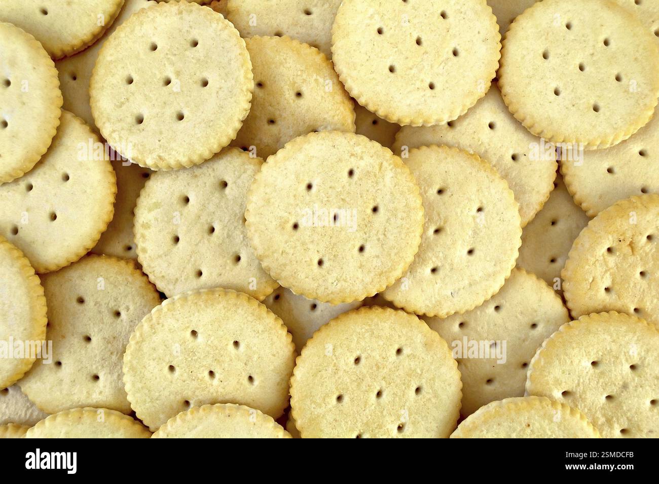 The texture of the yellow round crackers Stock Photo - Alamy