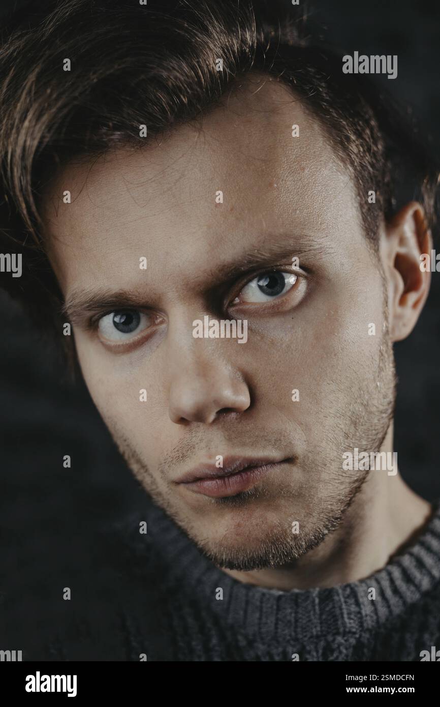 Man looks camera against backdrop hi-res stock photography and images ...