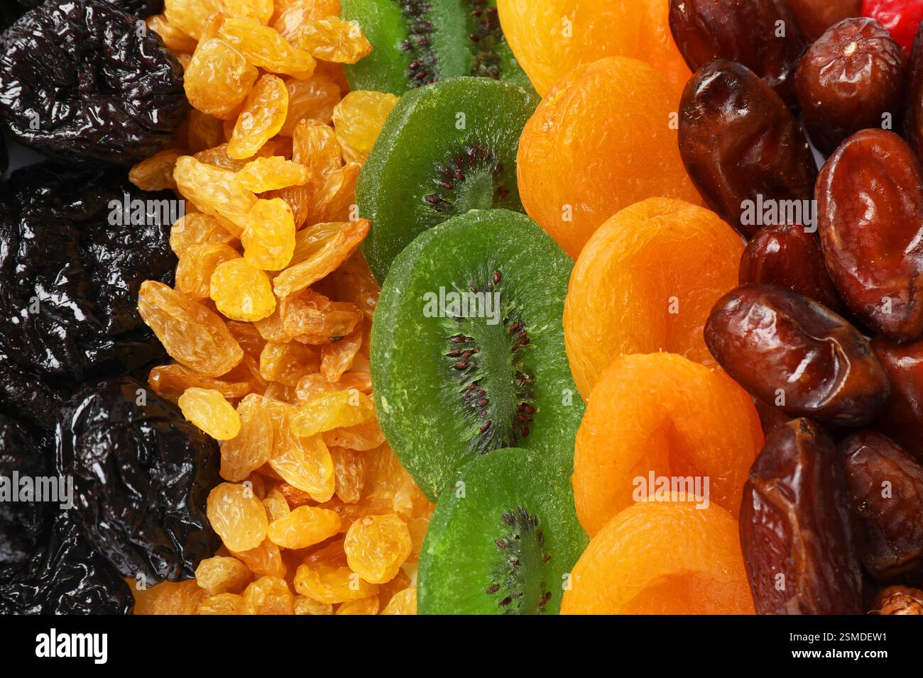 Different dried fruits as background, top view Stock Photo - Alamy