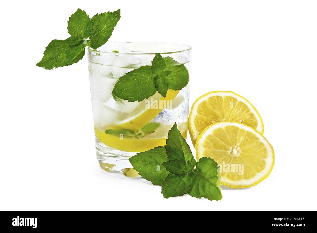Iced water, lemon slices, mint in a glass beaker, sliced â€‹â€‹lemon on the table isolated on ...