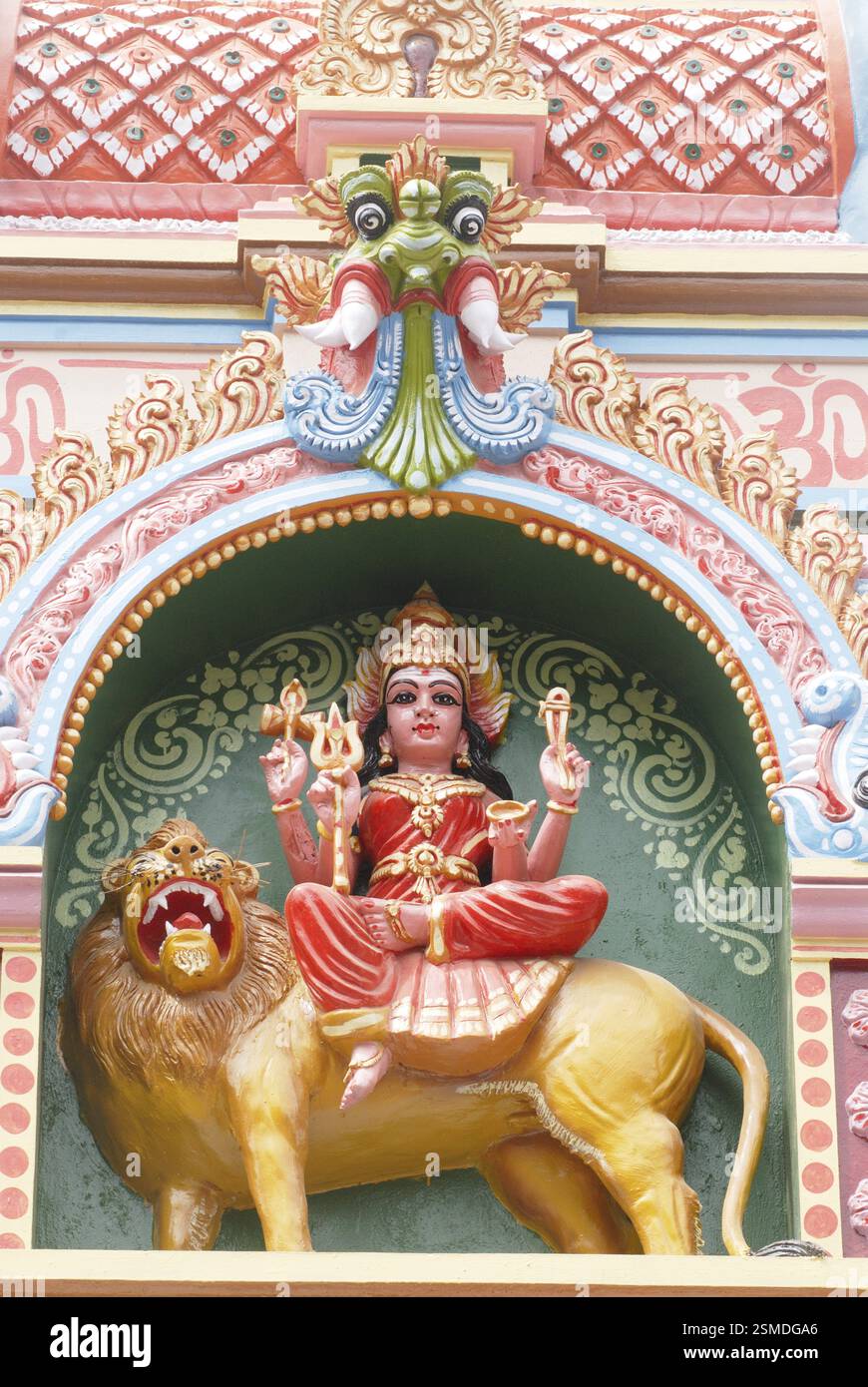 Colourful painted statue of goddess Durga mounted on lion fitted in ...