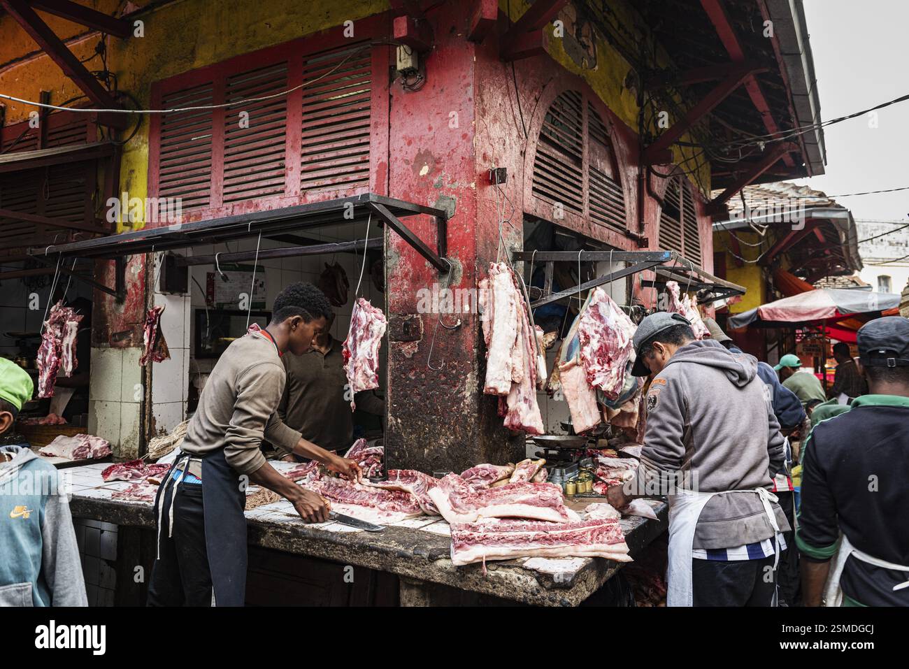 Butcher at meat stall, Analakely market Antanarivo, Madagascar, Africa ...