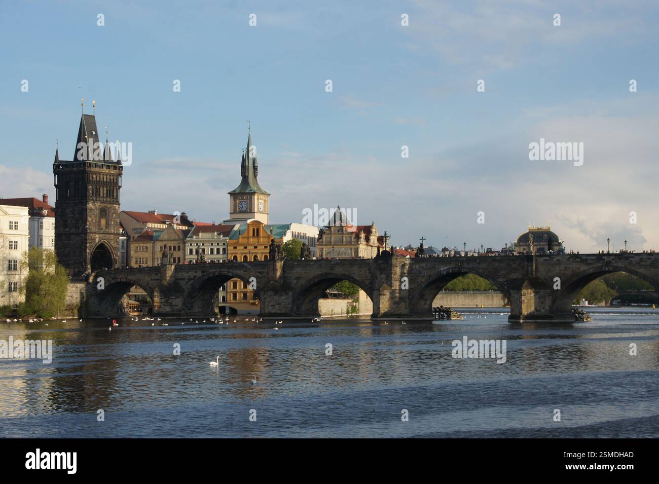 Charles Bridge is a stone bridge with Gothic towers, crossing the ...