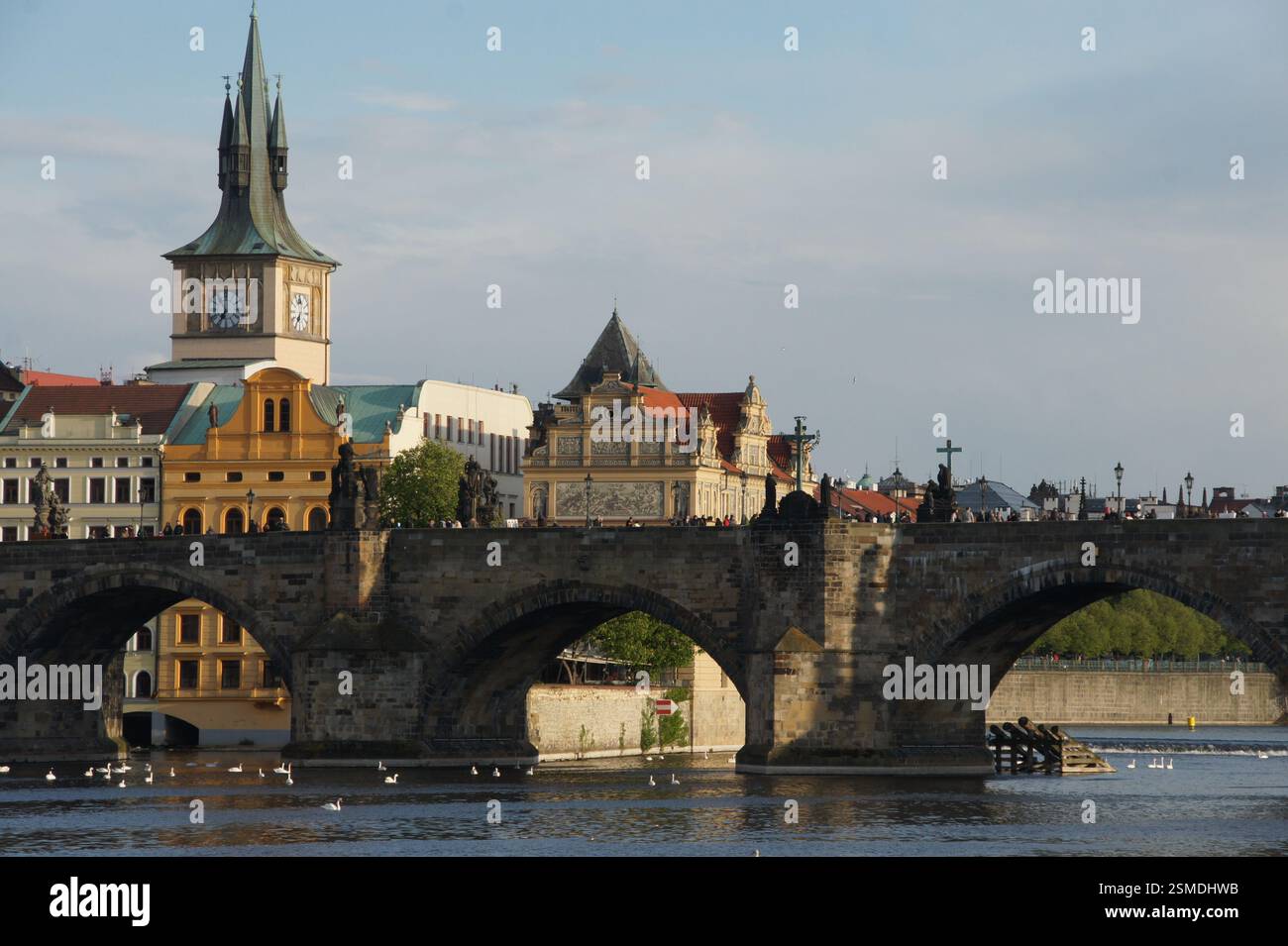 Charles Bridge is a historic stone bridge with multiple arches spanning ...
