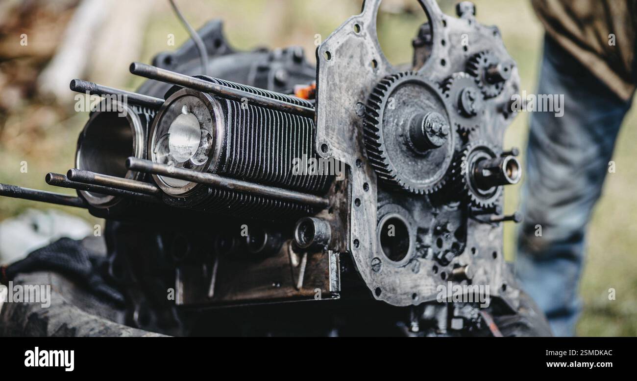 Detailed view of a disassembled engine with visible gears and ...