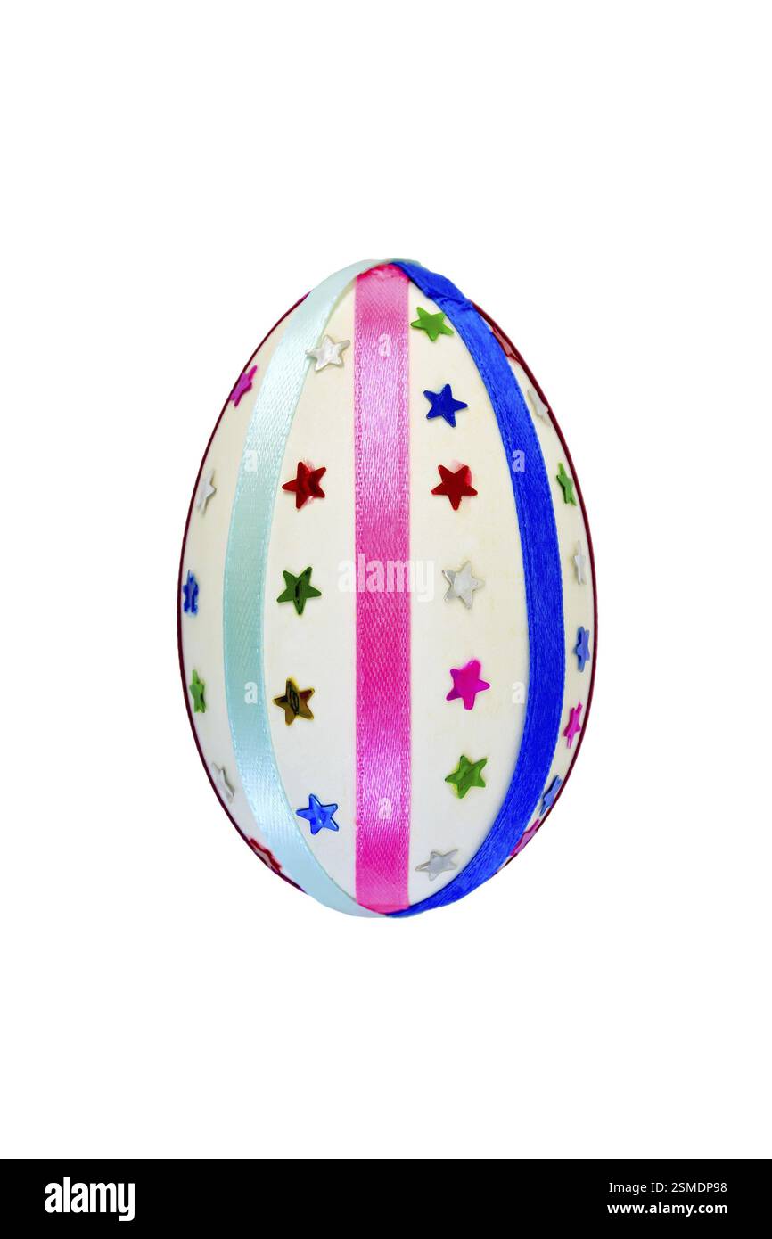 One easter egg, decorated with multicolored braid and sparkles in the ...