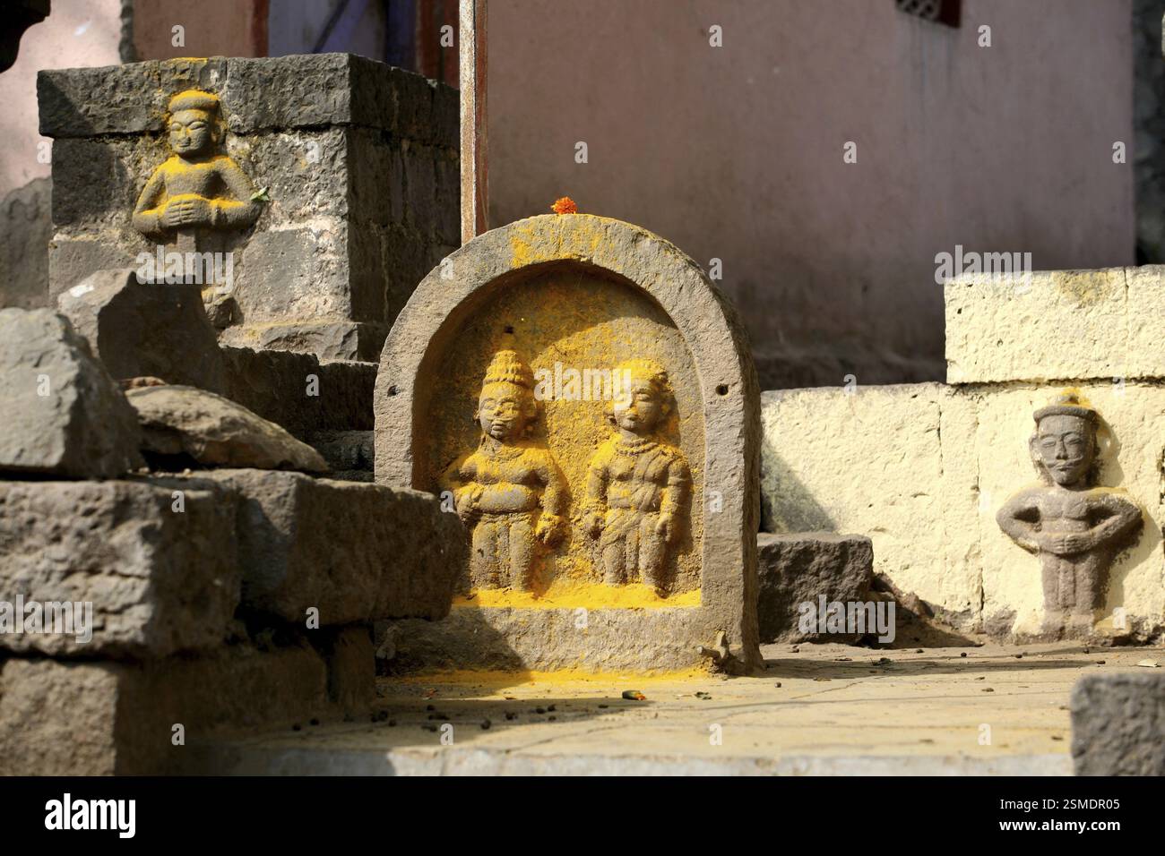 Statues immersed in turmeric powder at the Jejuri temple, Pune ...